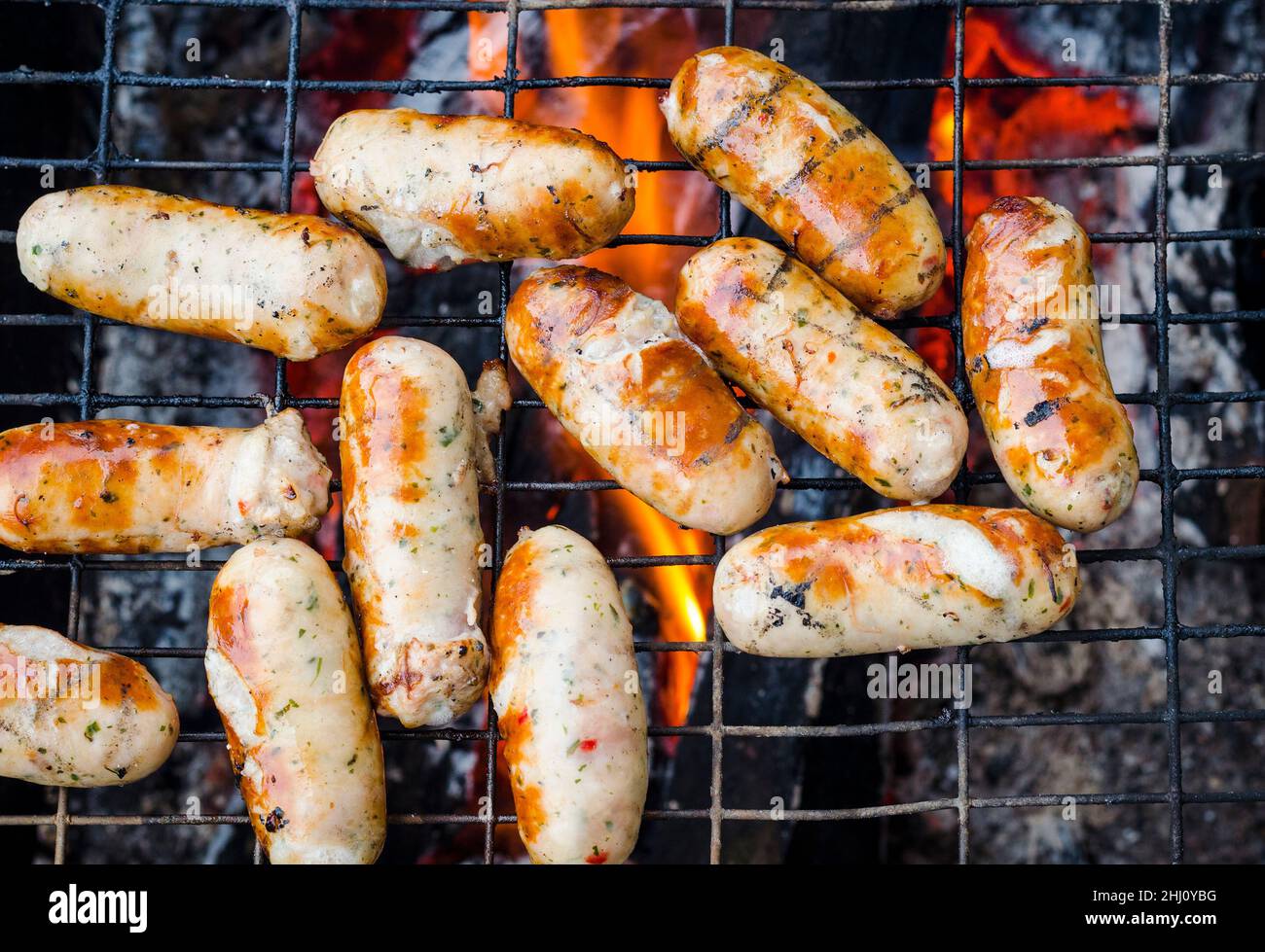meat fried sausages on a bonfire in the summer Stock Photo - Alamy