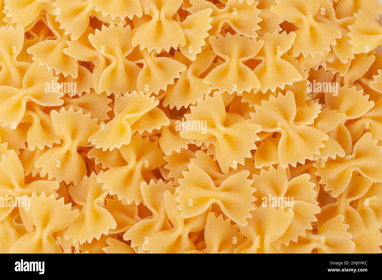 Pasta farfalle butterfly texture or background Stock Photo - Alamy
