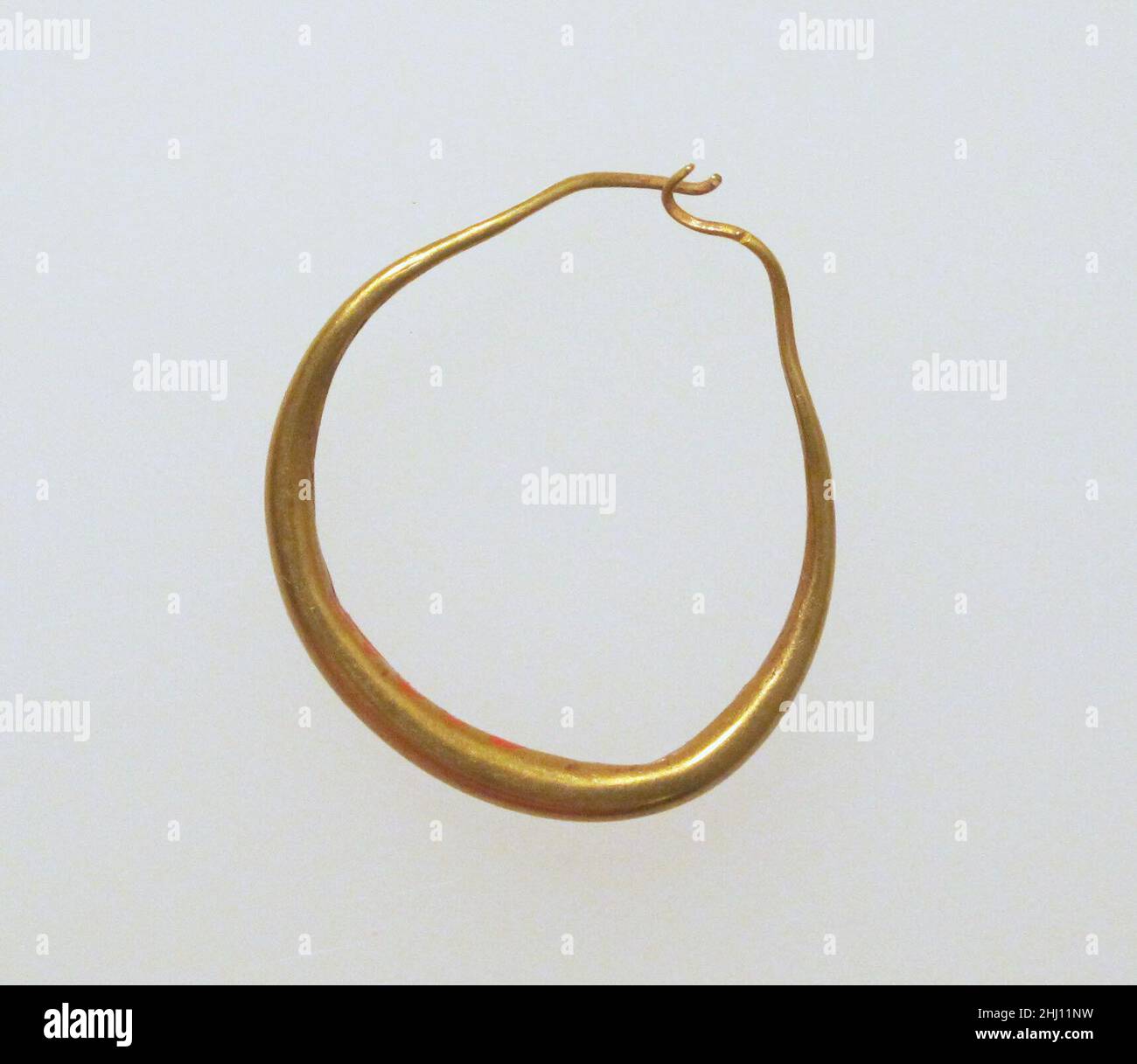 Gold loop earring hi-res stock photography and images - Alamy