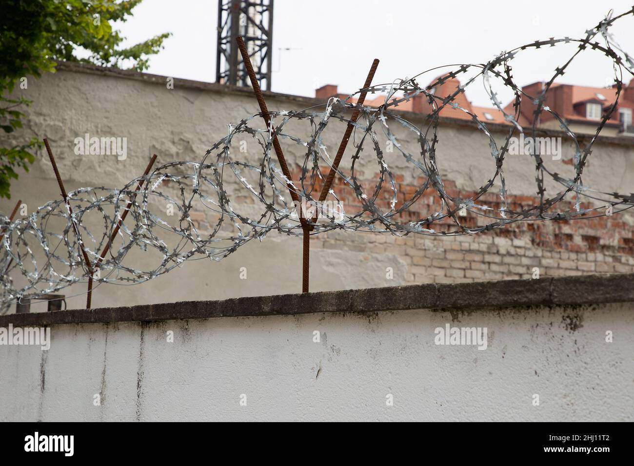 Russia. Moscow. Fencing of secure facilities. Barbed wire on the fence ...