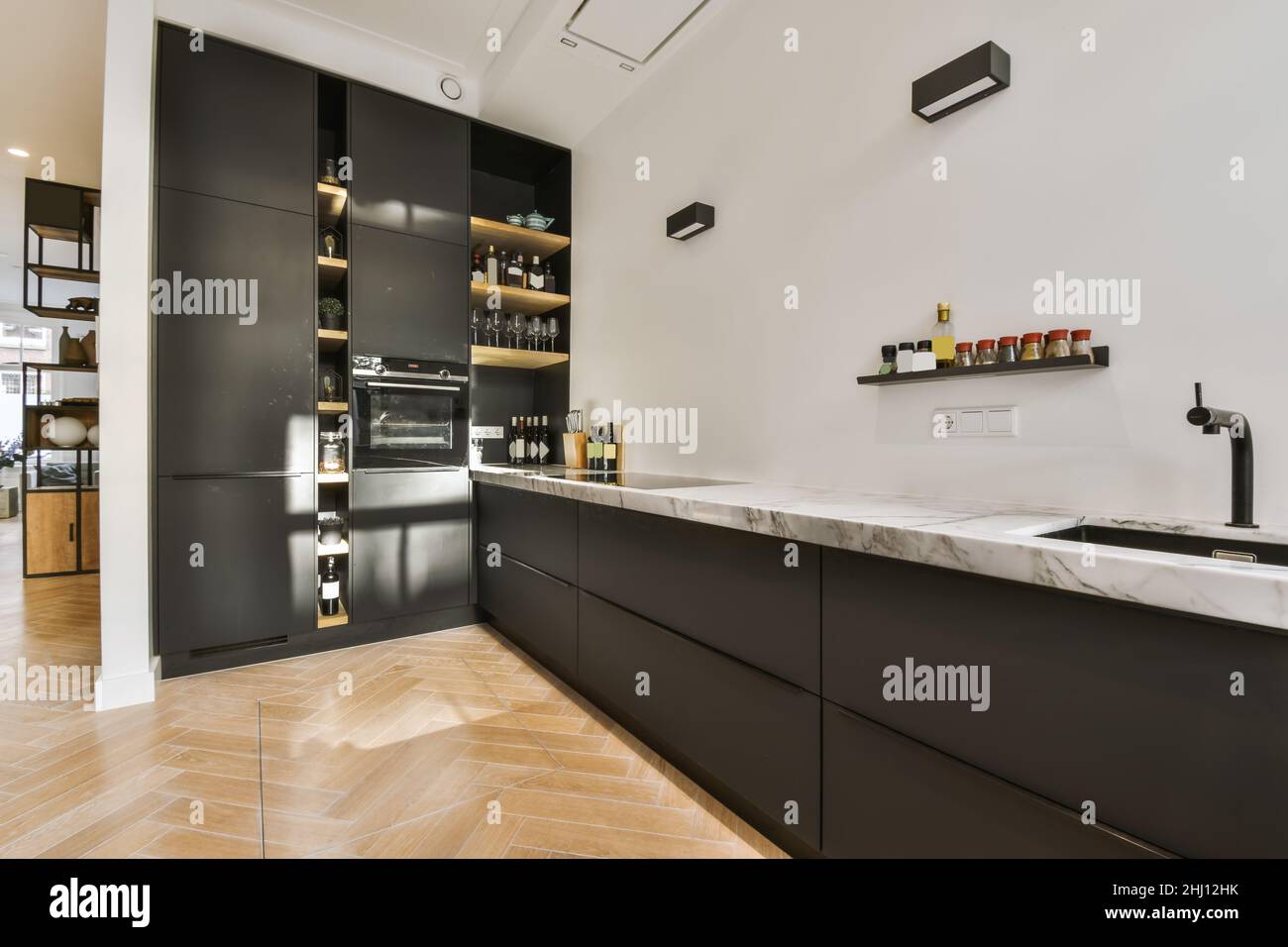 Delightful kitchen with black kitchen unit and long countertop Stock ...