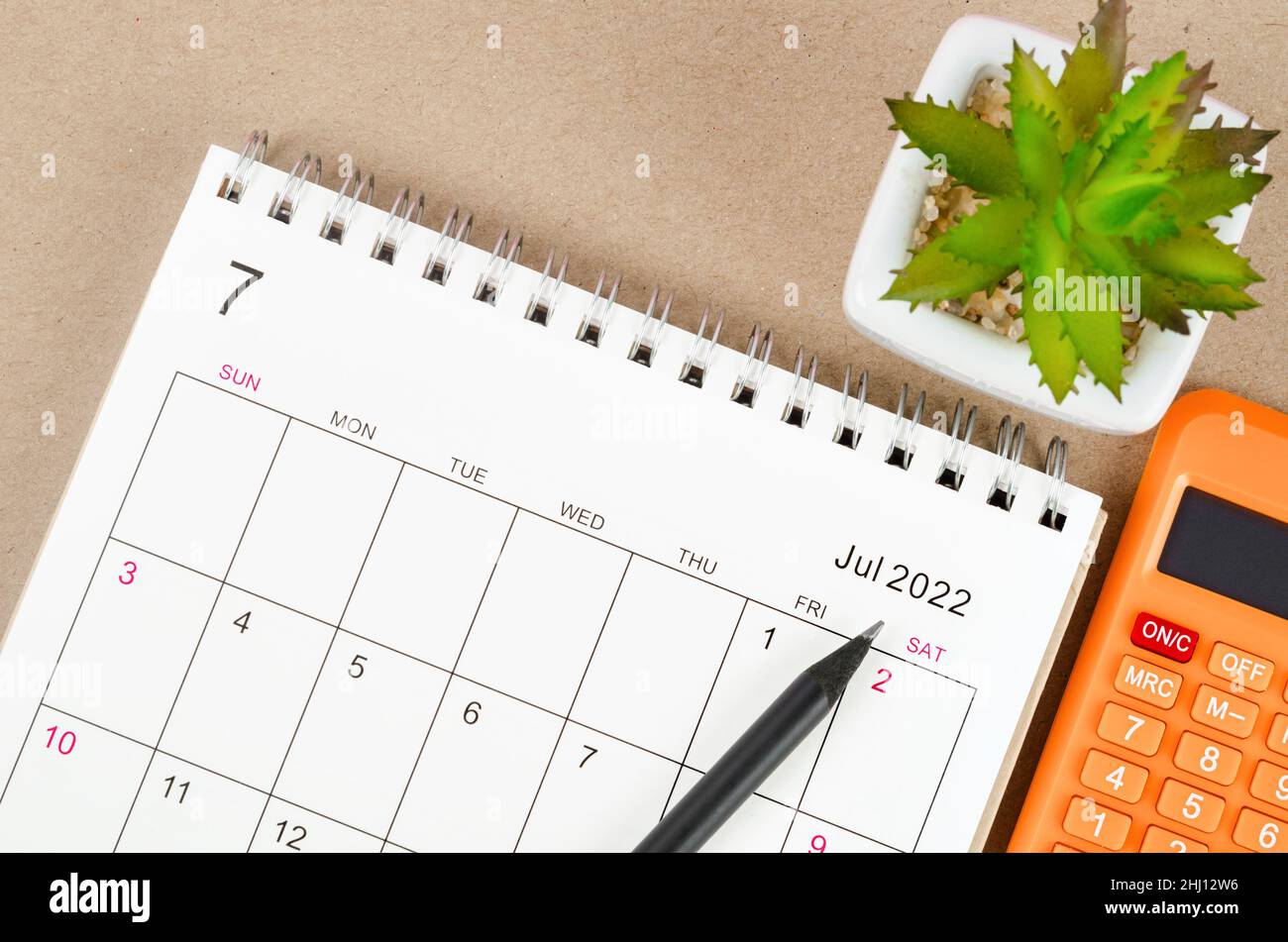 The July 2022 desk calendar with calculator Stock Photo - Alamy