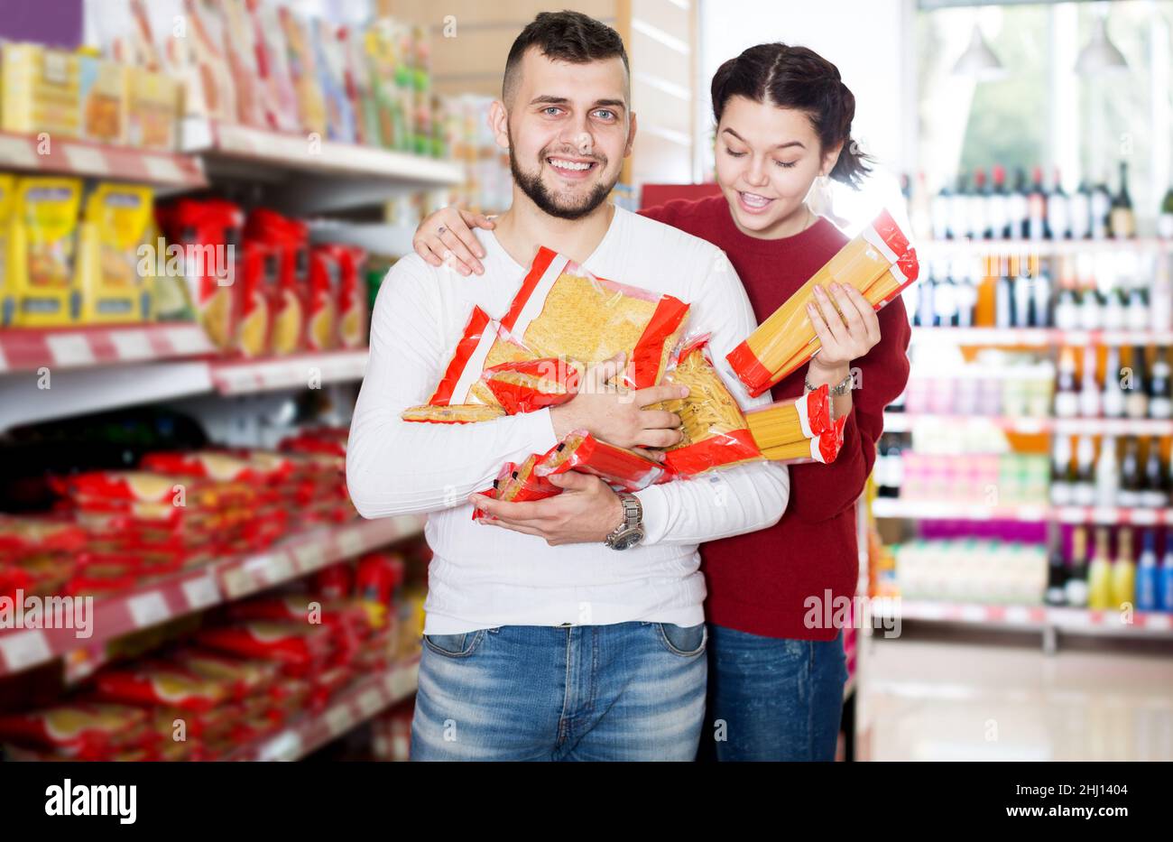 Adults reading lable of pasta Stock Photo - Alamy