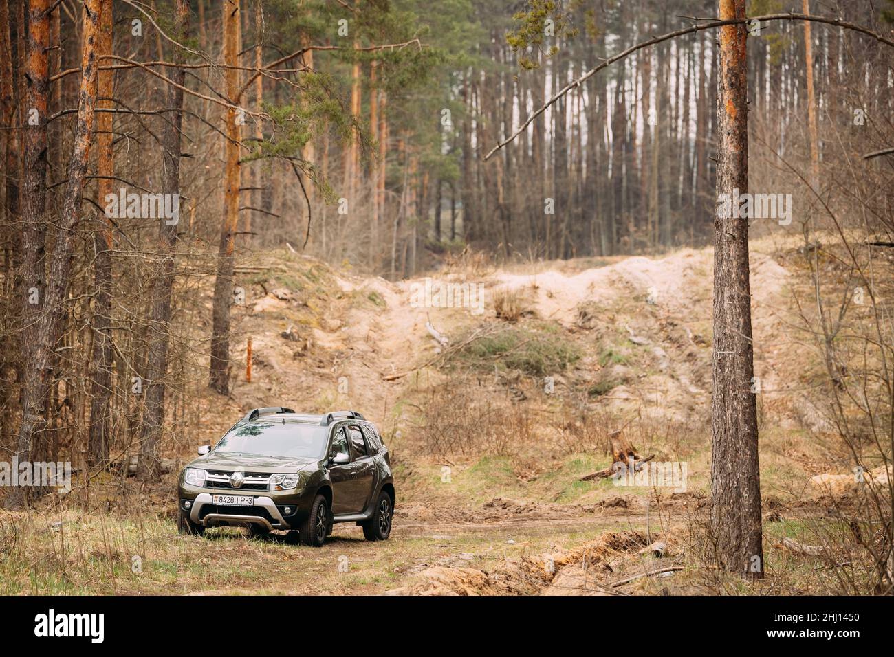 Green Car Renault Duster Or Dacia Duster Suv Parked In Forest Stock ...