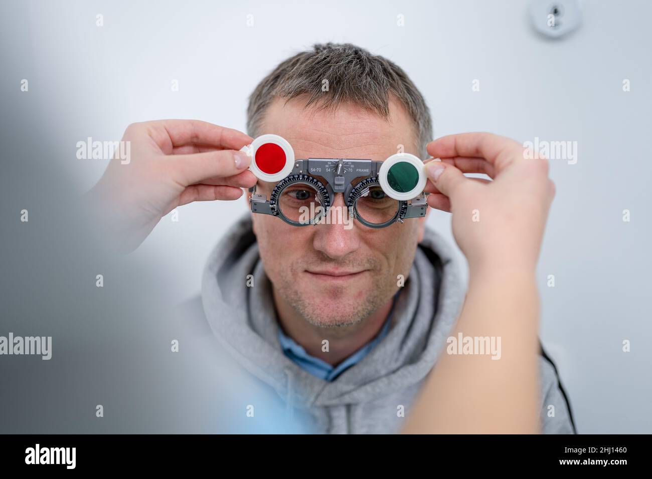 Male patient undergoes an eye test and prescription for eyeglasses in ...