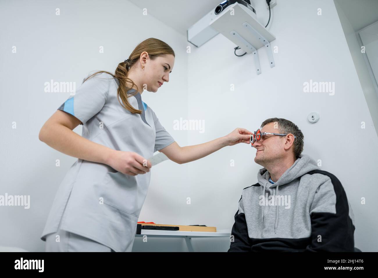 Male patient undergoes an eye test and prescription for eyeglasses in ...