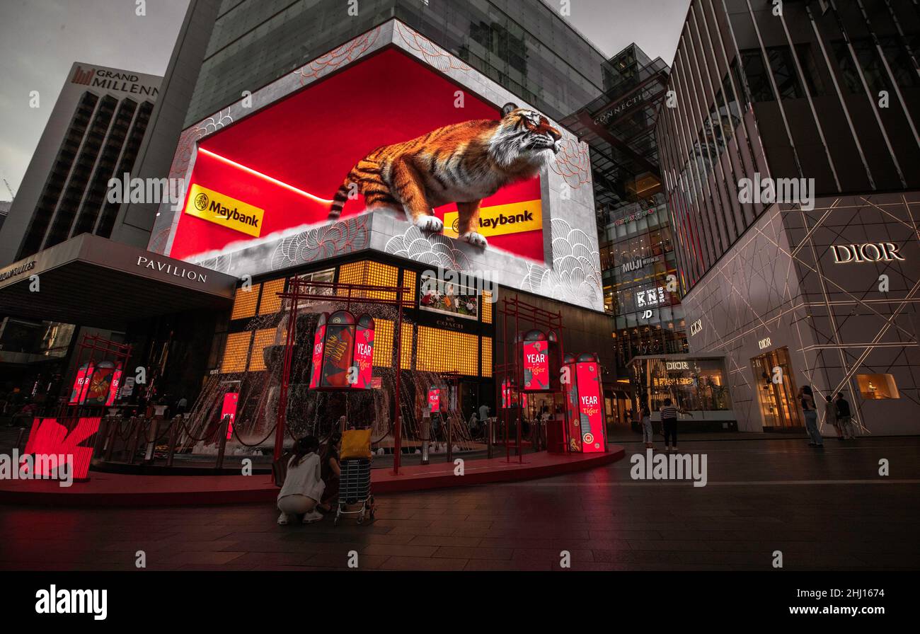 People are seen near the electronic board featuring the Year of Tiger ...