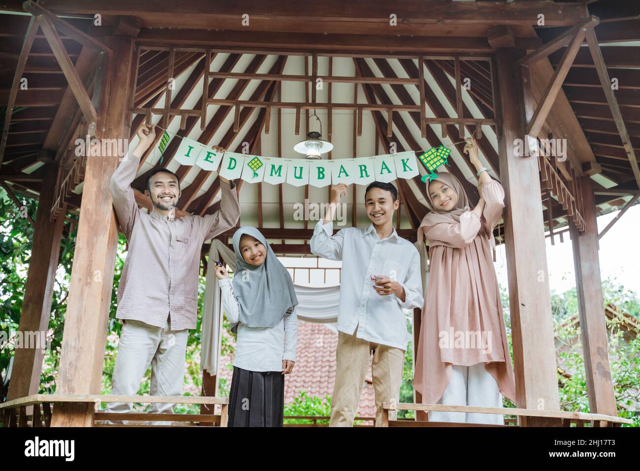 Muslim family decorates gazebo to celebrate Eid Mubarak Stock Photo - Alamy