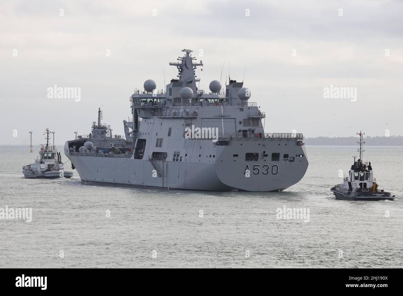 Tugs escort the Royal Norwegian Navy replenishment oiler HNoMS MAUD ...