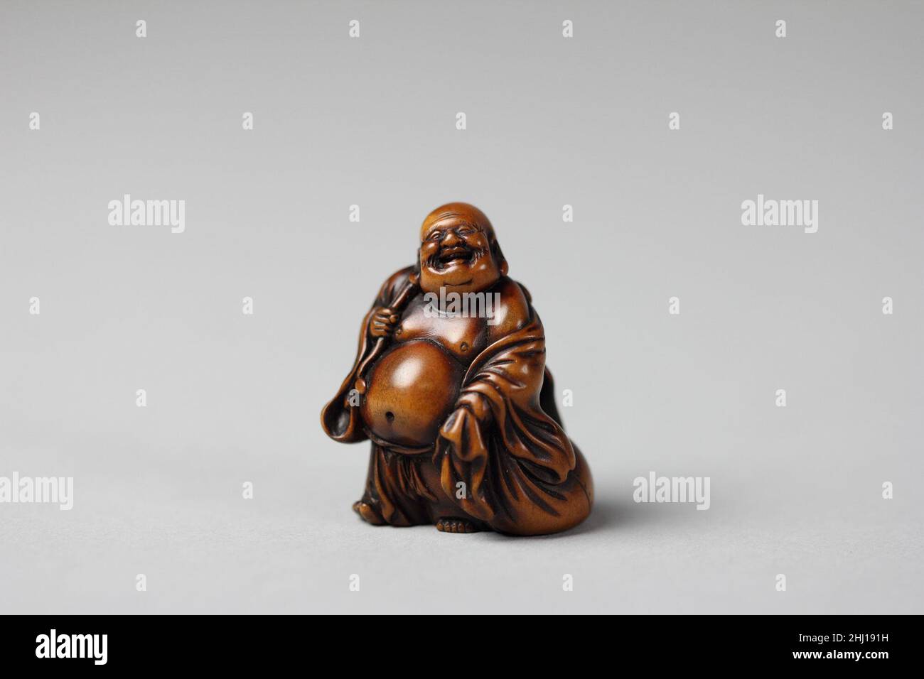 Netsuke of Hotei and Bag with Fan 19th century Japan. Netsuke of Hotei ...