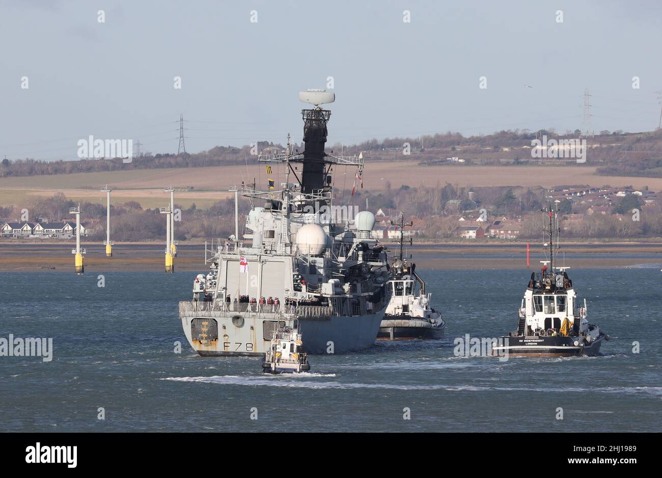 Tugs guide the frigate HMS KENT towards a berth in the Naval Base on ...
