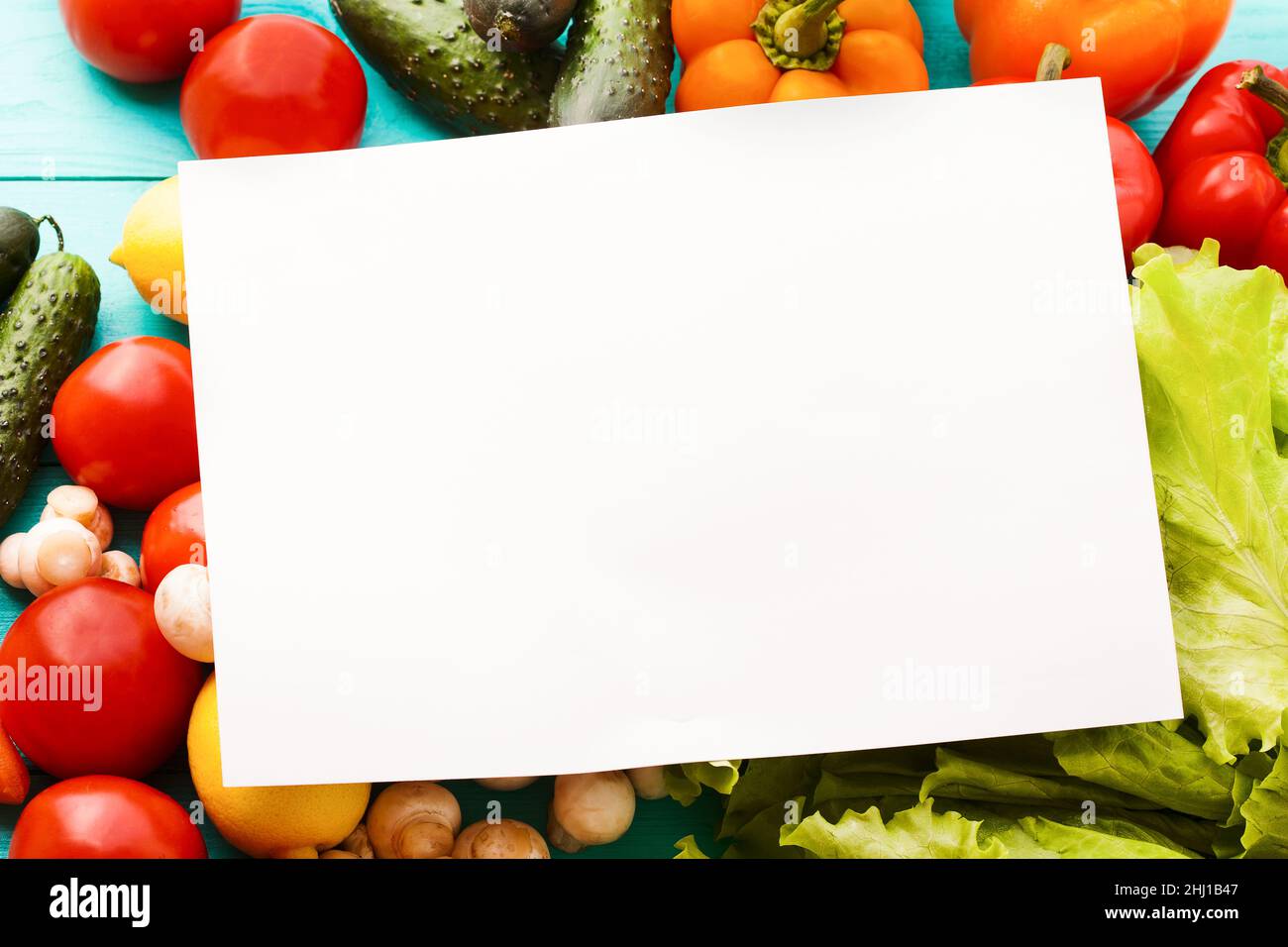 Recipe paper with vegetables on blue table. Top view and macro Stock ...