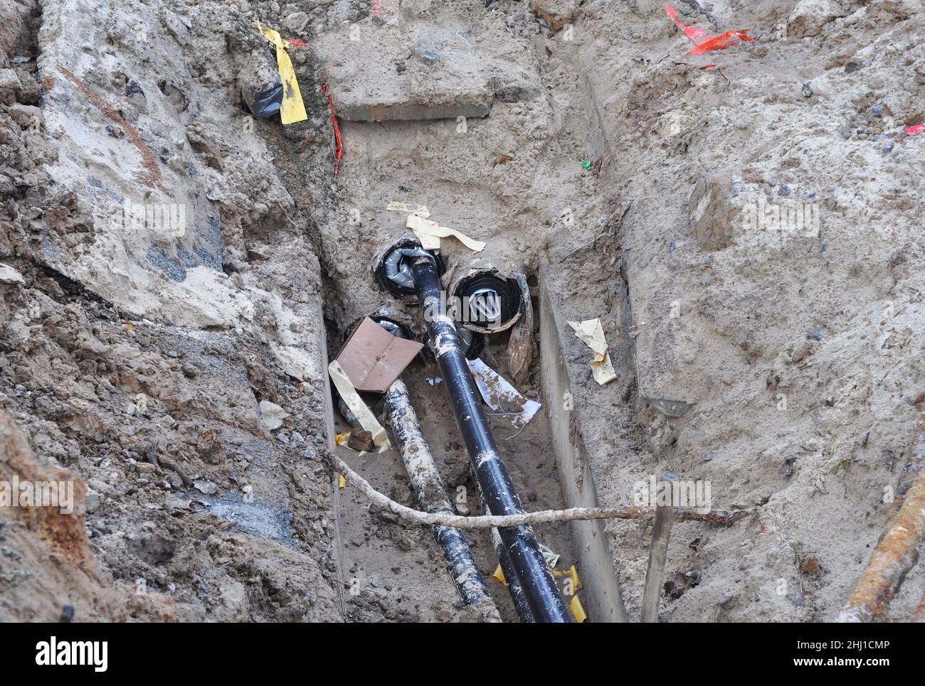 Electric and internet cables, optical fibres in the digging on the ...