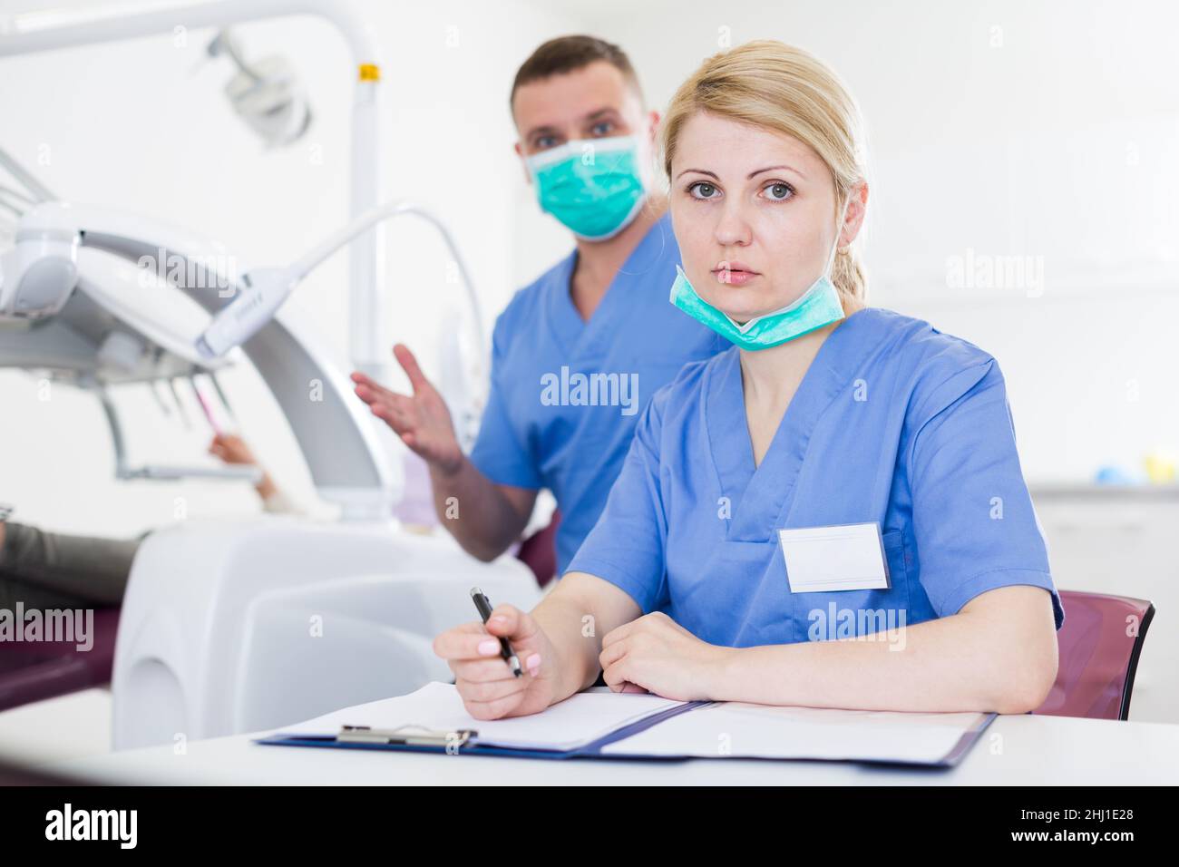 Female stomatologist recording diagnosis Stock Photo - Alamy
