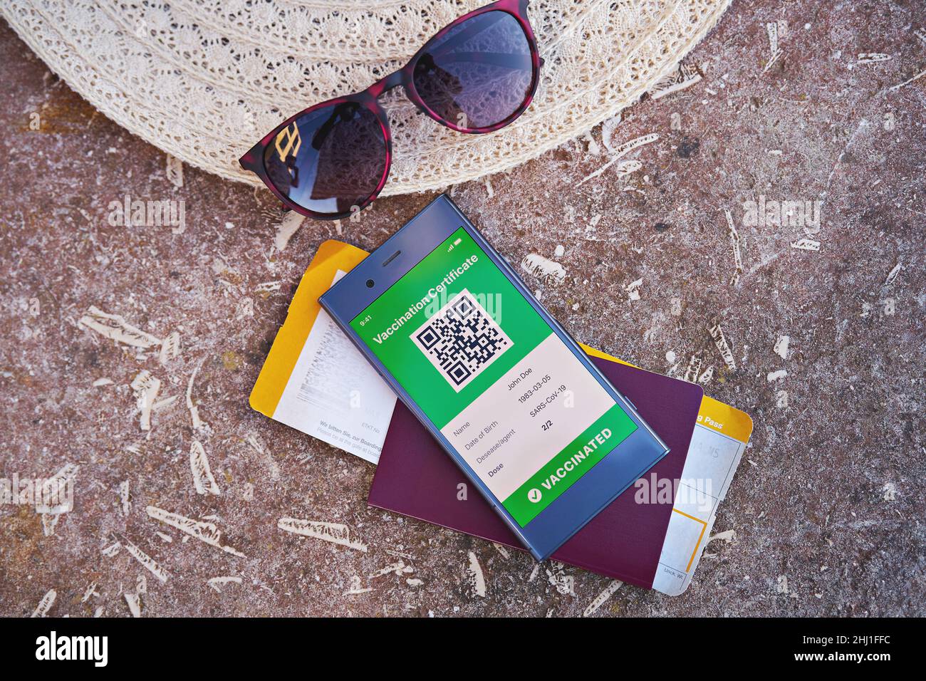 Smartphone displaying valid digital vaccination certificate QR Code for ...