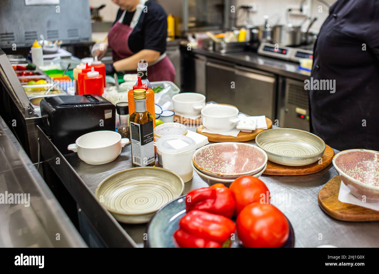 Professional chef cooking in the kitchen restaurant at the hotel ...