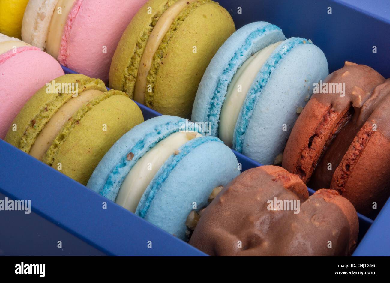 Exclusive macaroons in blue box collection with flavor Stock Photo - Alamy