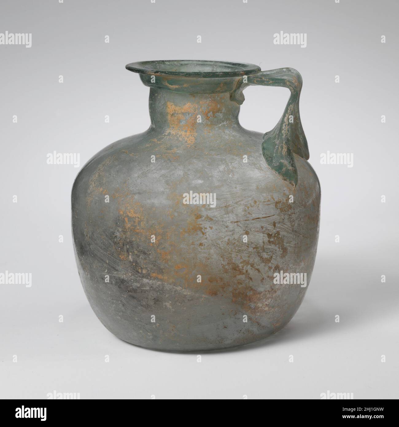 Glass jug mid-1st–2nd century A.D. Roman Translucent blue green; handle ...