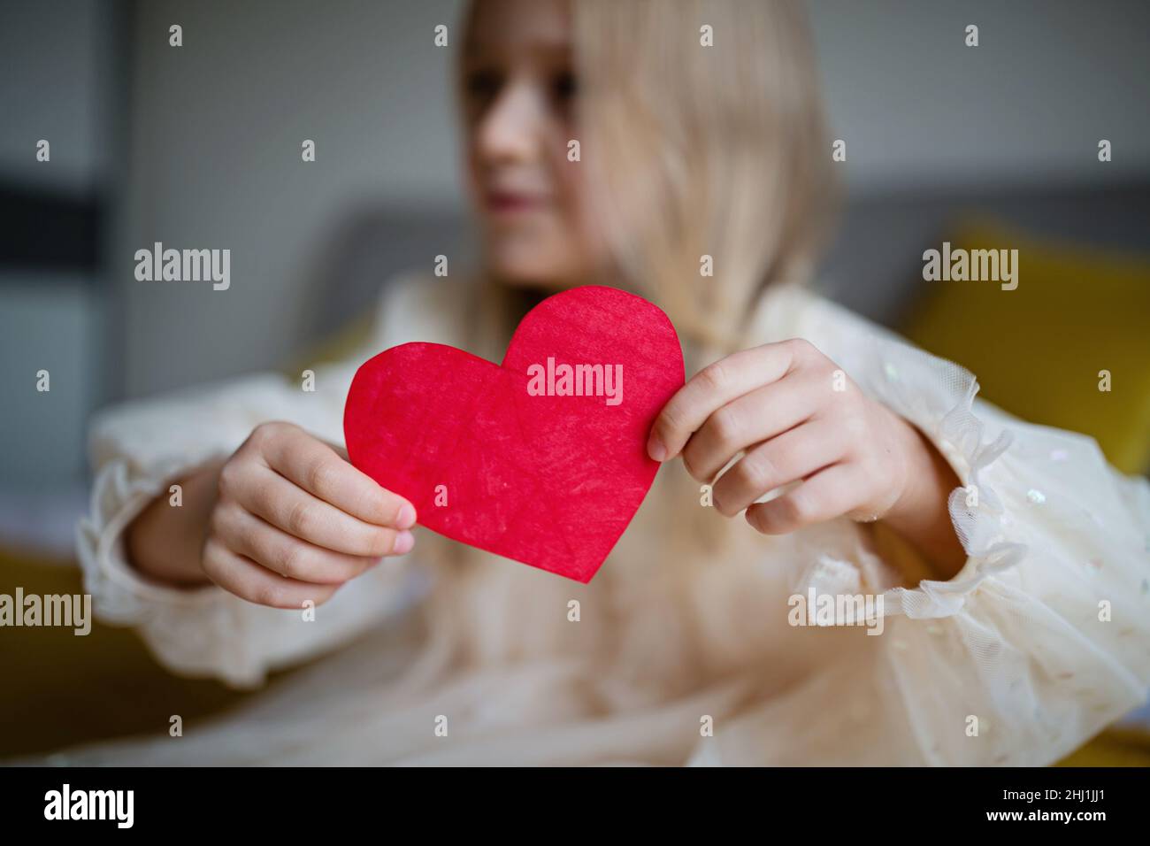 Little school kid girl holding red heart. Valentine's day during ...