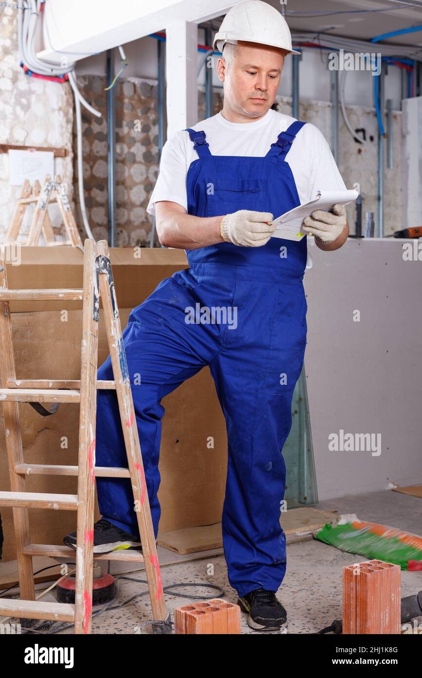 Portrait worker inspecting construction hi-res stock photography and ...