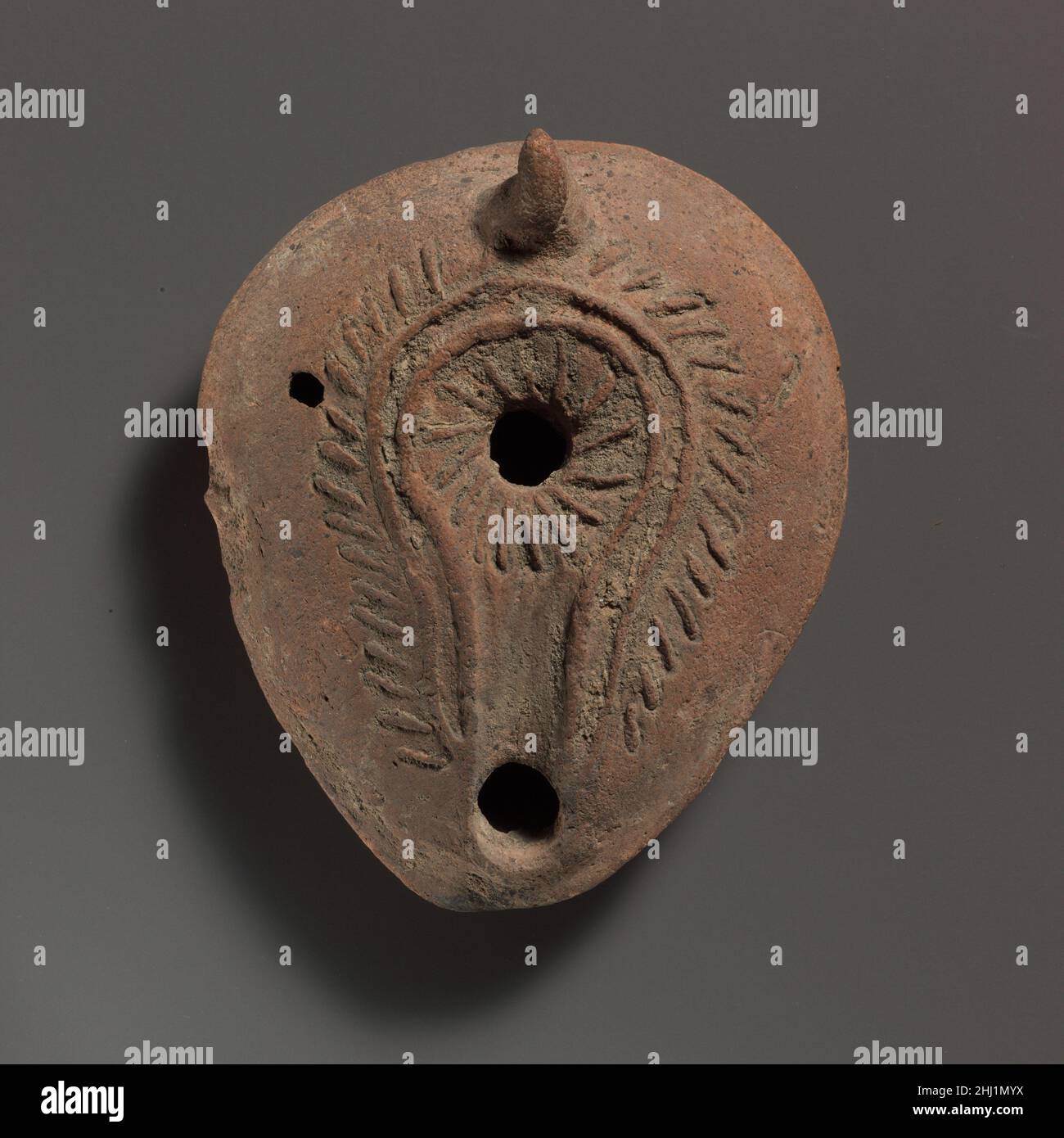 Terracotta oil lamp 7th century A.D. Roman Mold-made, with applied ...