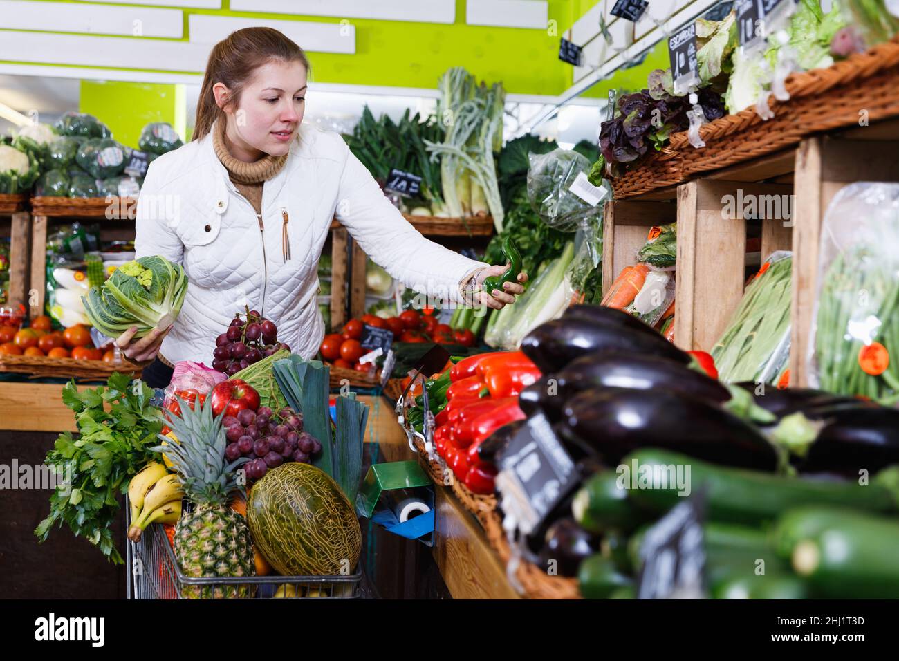 Woman in store of fruits and vegetables Stock Photo - Alamy