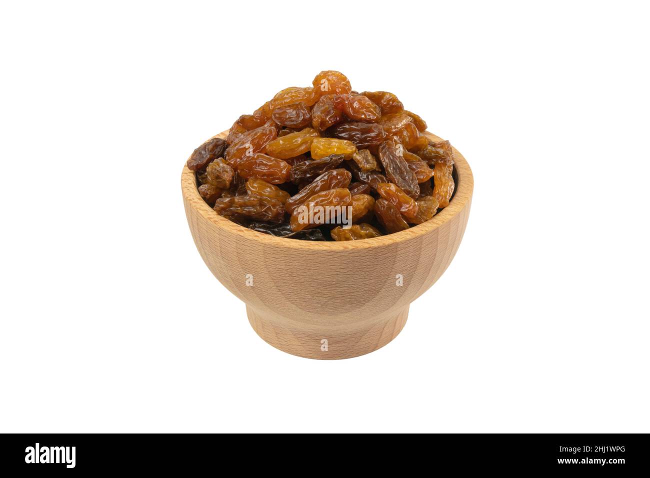 royal raisins in wooden bowl isolated on white background.Spice and ...