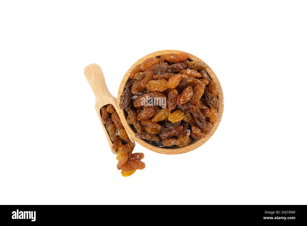royal raisins in wooden bowl and scoop isolated on white background ...