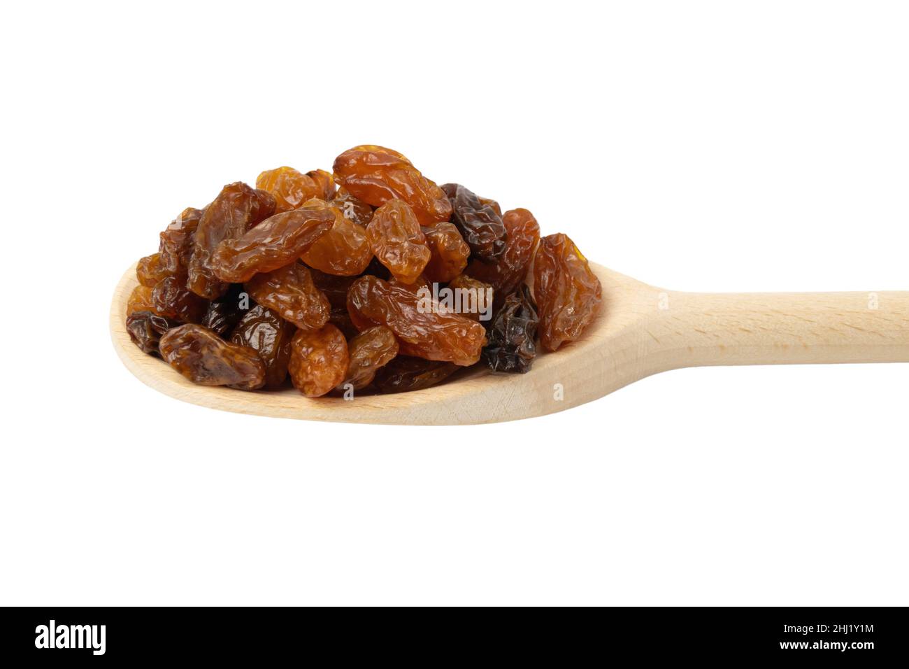 royal raisins on wooden spoon isolated on white background. Spice and ...