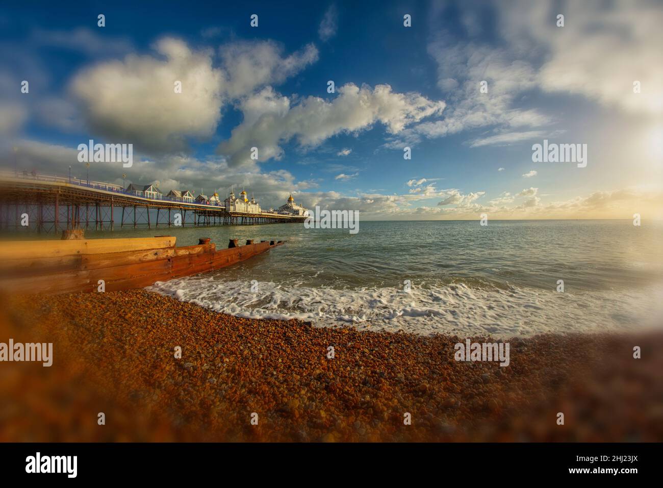 landscape with the tourist favourite Eastbourne Pier on the south coast ...