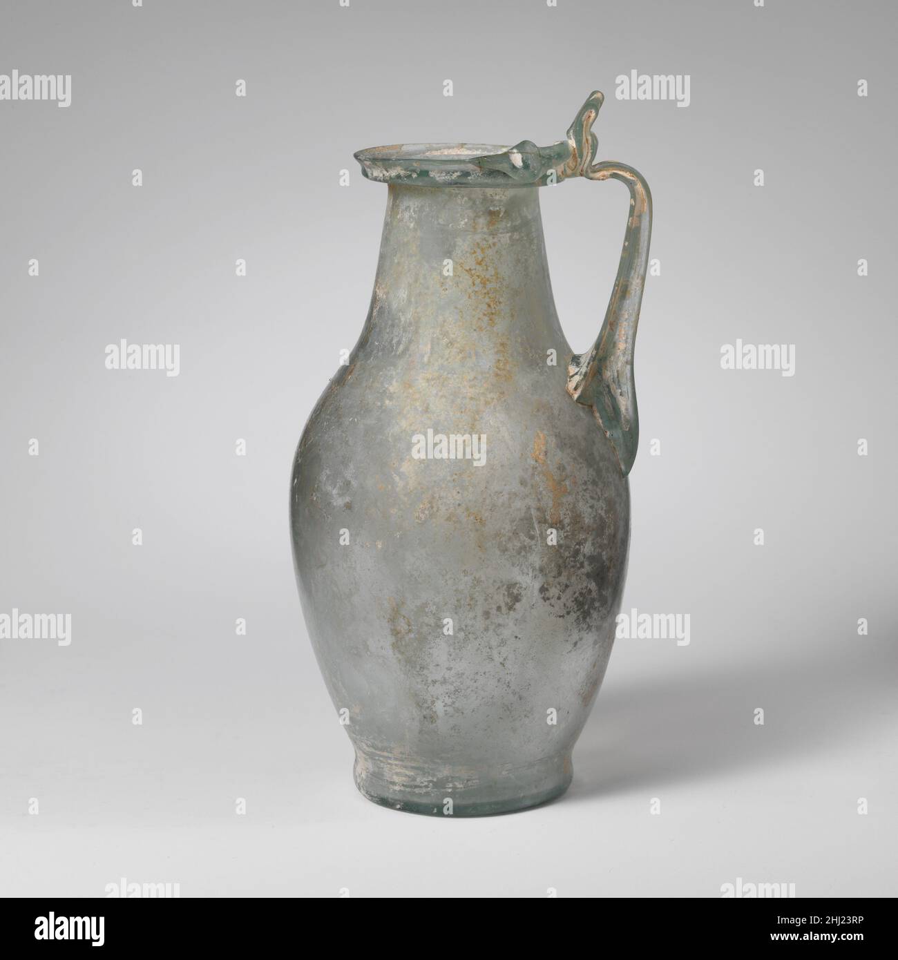 Glass jug mid-1st–2nd century A.D. Roman One-handled jug of olpe shape ...