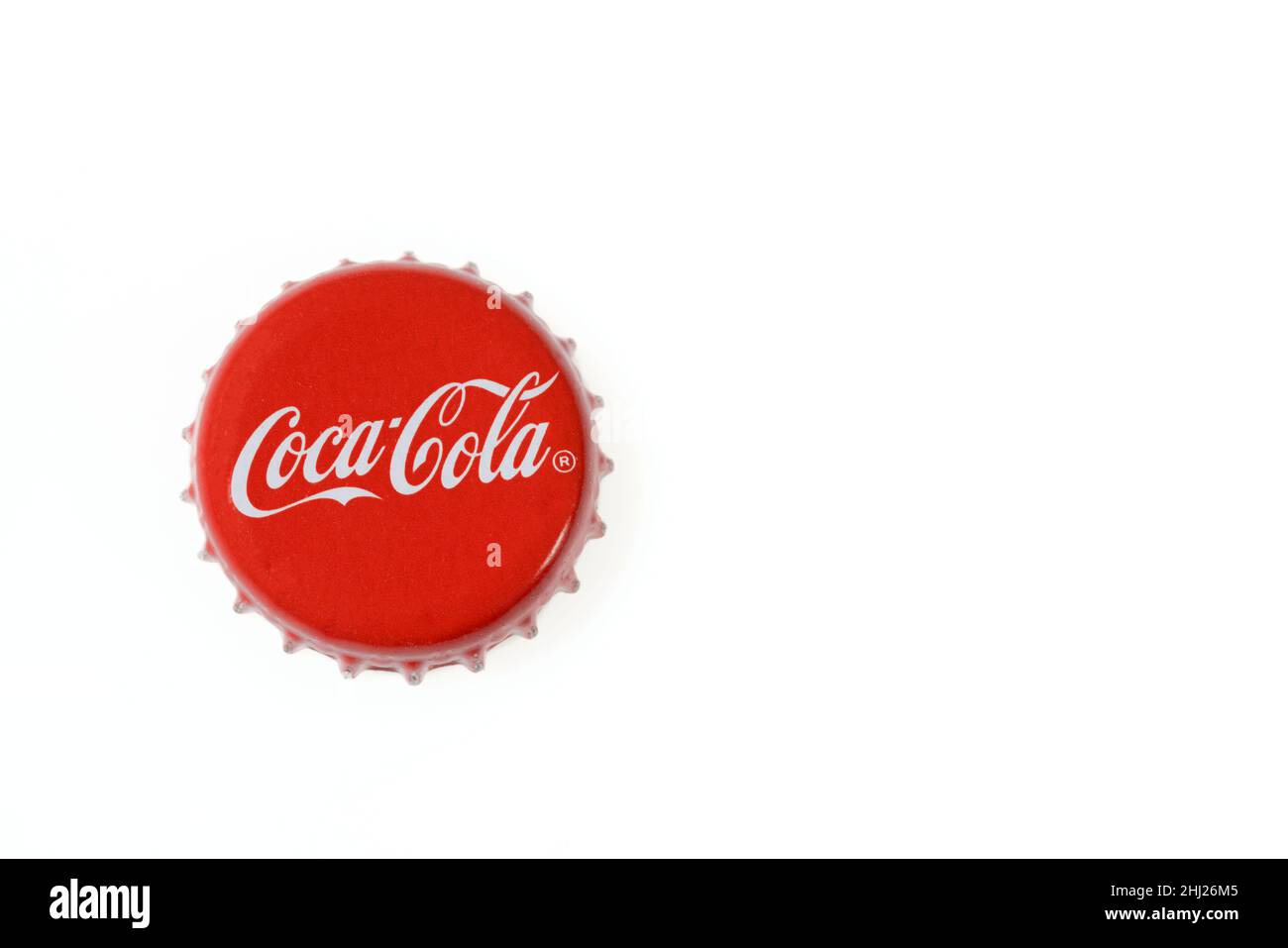 Close up view of Coca Cola metal cap isolated on white background ...