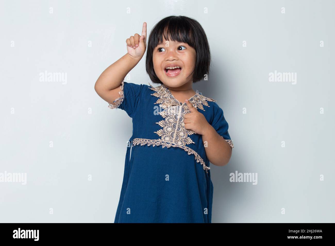 happy asian little girl thinks idea isolated on white background Stock ...