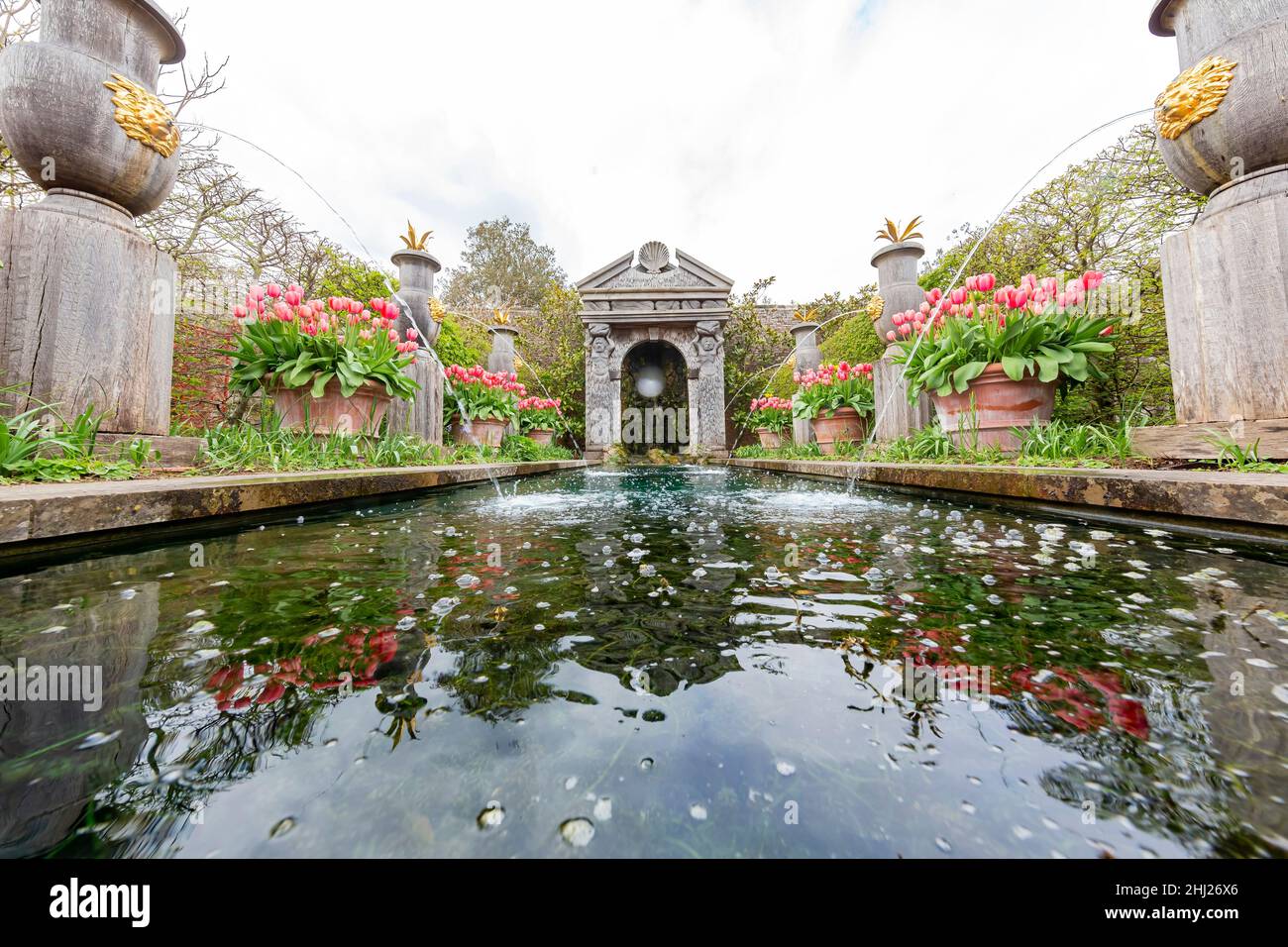 Overcast view of the garden of Arundel Castle with many flower blossom ...