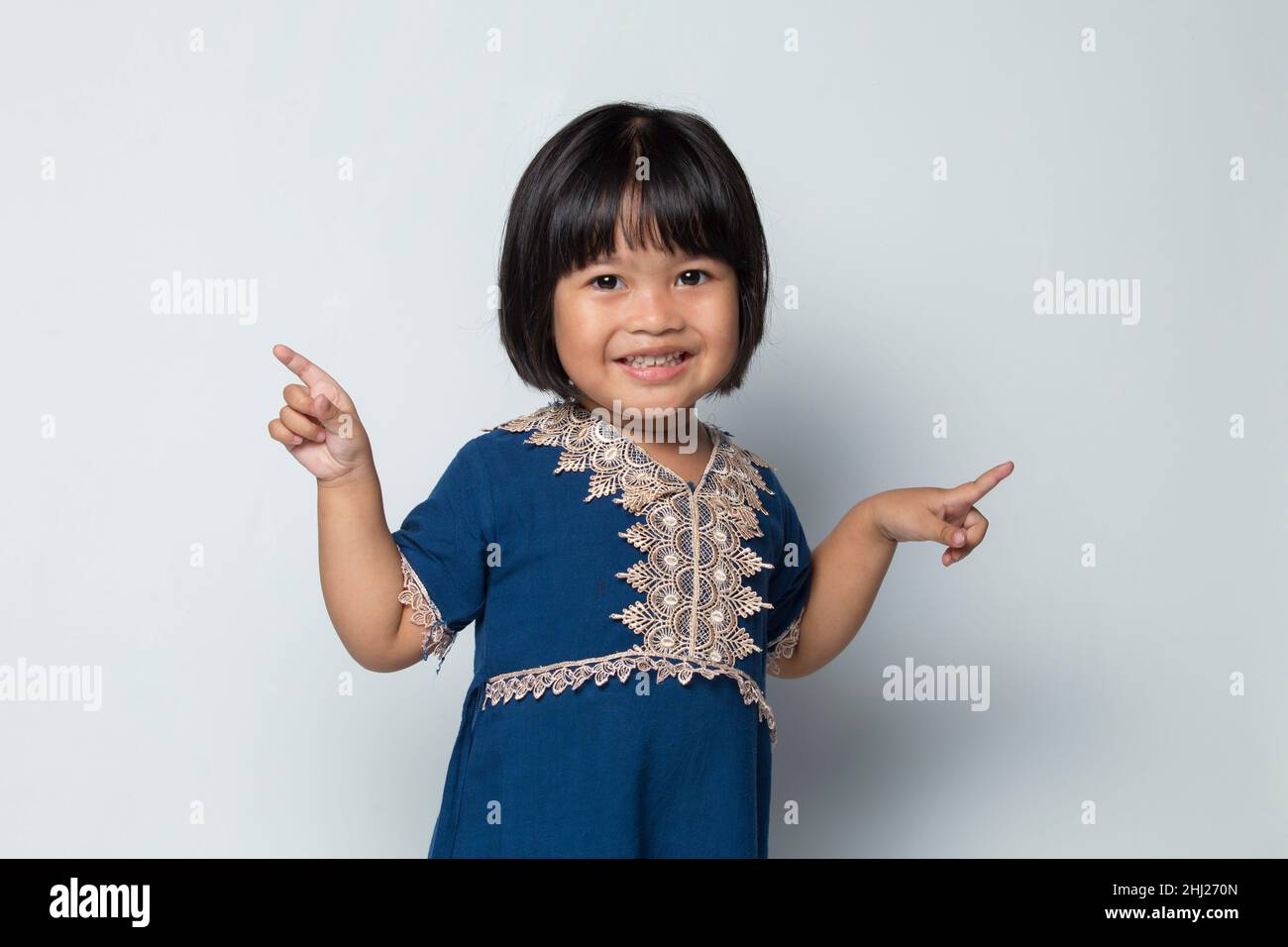 happy asian little girl thinks idea isolated on white background Stock ...