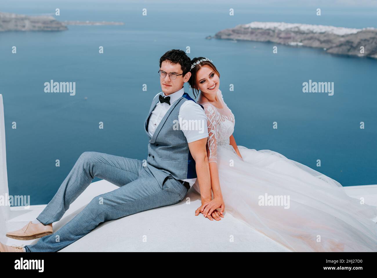 beautiful bride and groom in their summer wedding day on greek island ...