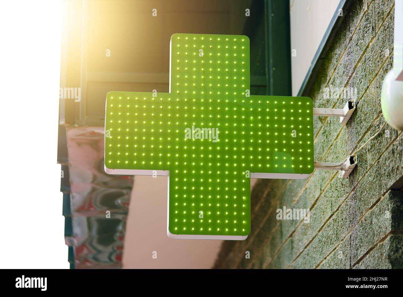 Pharmacy green light cross board Stock Photo - Alamy