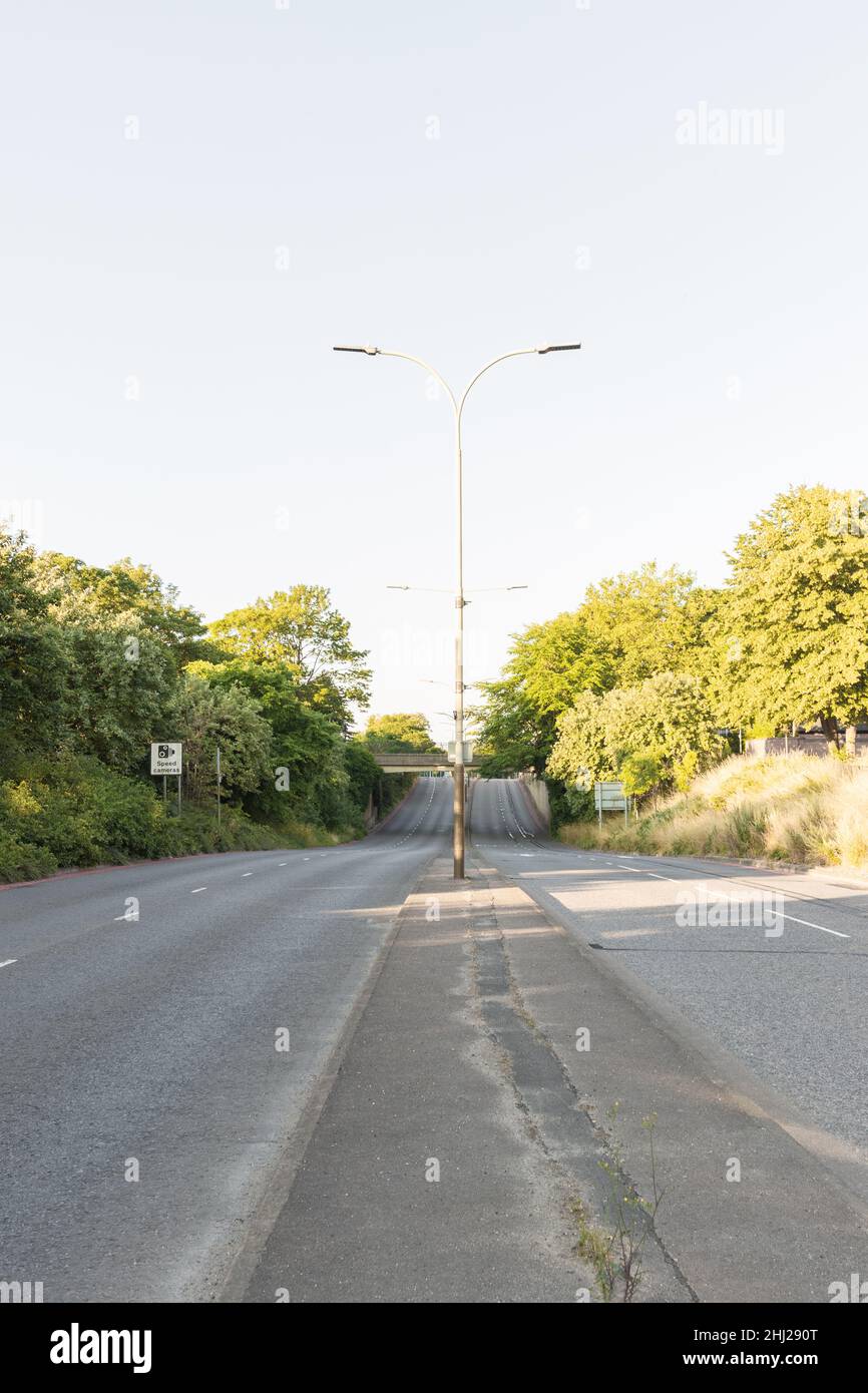 Waterloo Way going under underpass of middle of New Walk. Trees on left ...