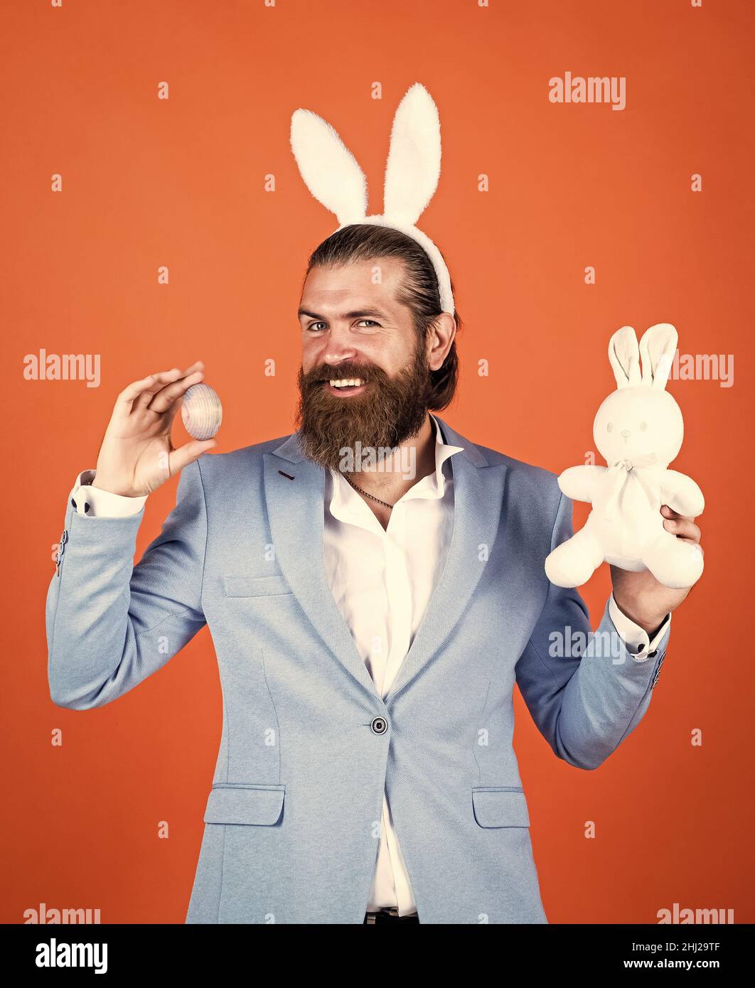 decoration easter egg. male funny egg hunt. bearded man in formalwear ...