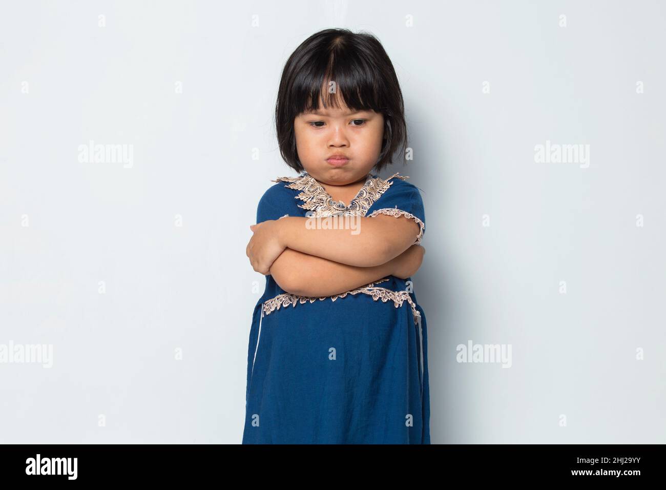 Mad child arms crossed High Resolution Stock Photography and Images - Alamy