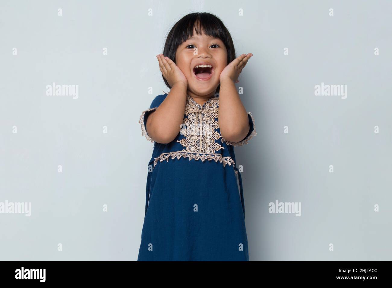 shock Asian little girl feeling surprise isolated on white background ...