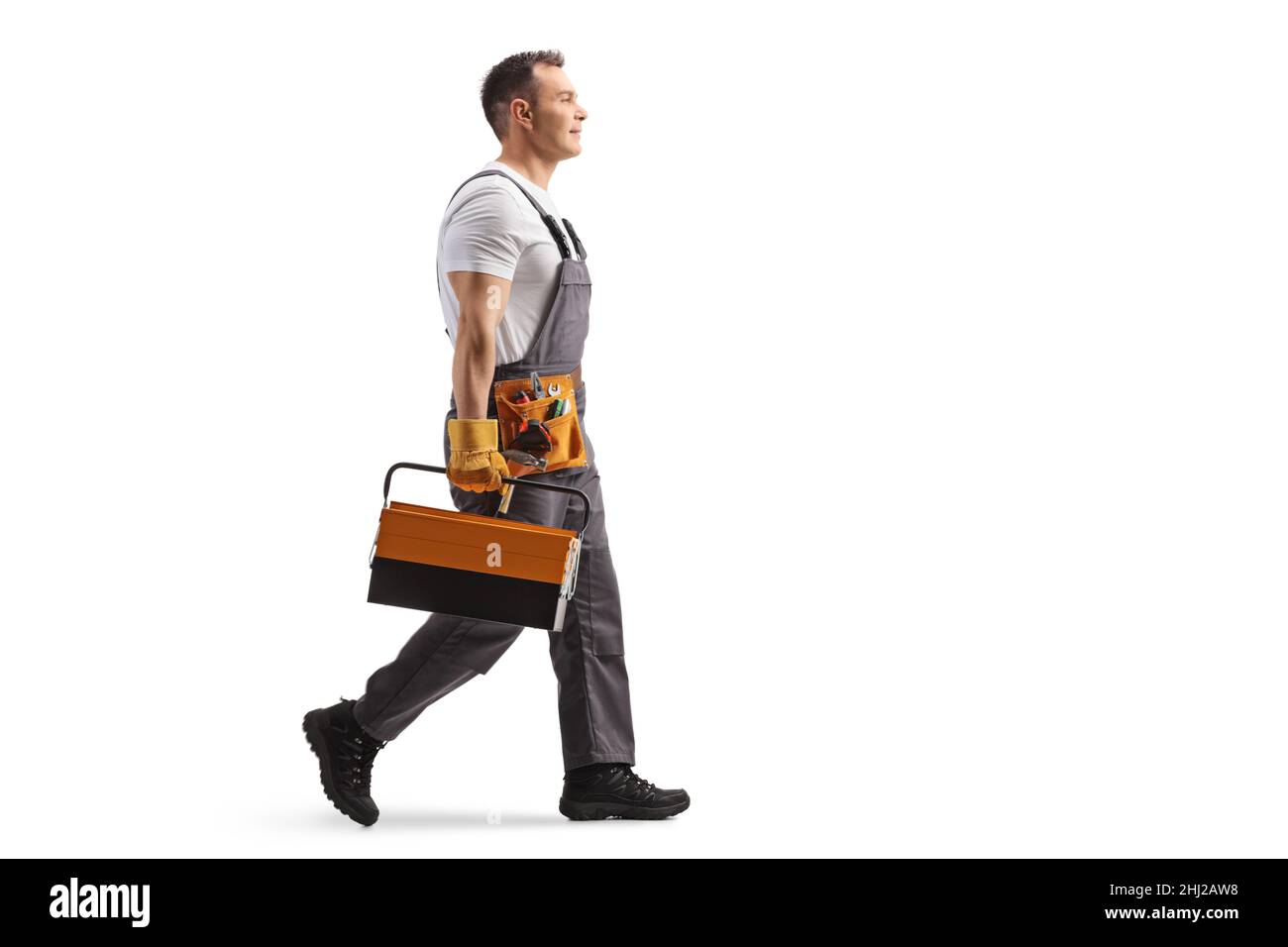 Repairman walking with a tool box isolated on white background Stock ...