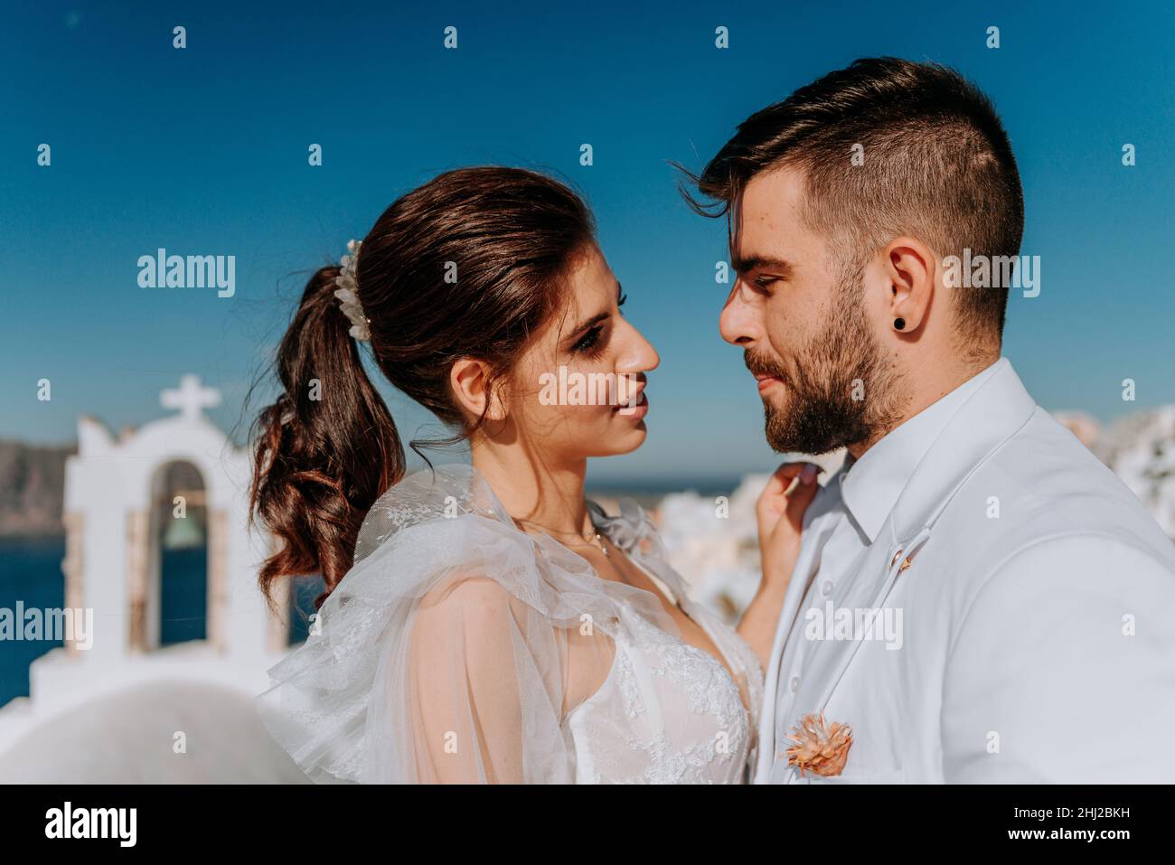 beautiful bride and groom in their summer wedding day on greek island ...
