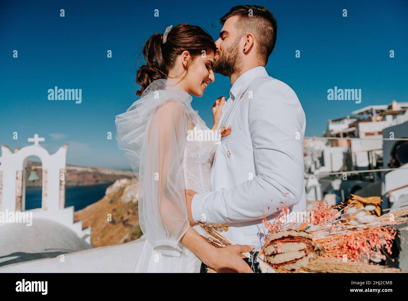 beautiful bride and groom in their summer wedding day on greek island ...