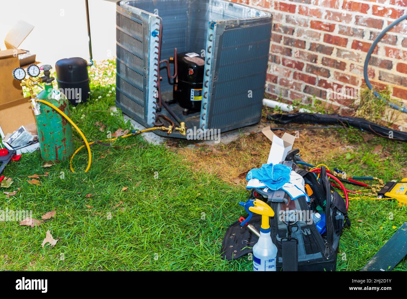 Maintenance being performed on air conditioner system Stock Photo - Alamy