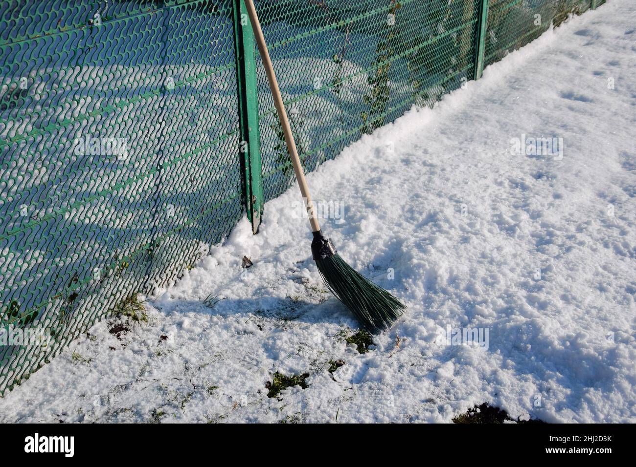 Sweeping snow with a broom hi-res stock photography and images - Alamy
