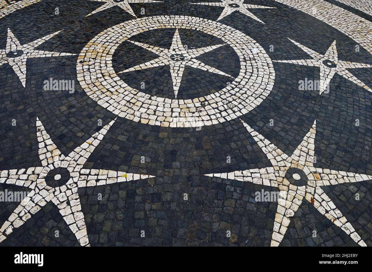 Traditional portuguese stone mosaic calcade with basalt and limestone ...
