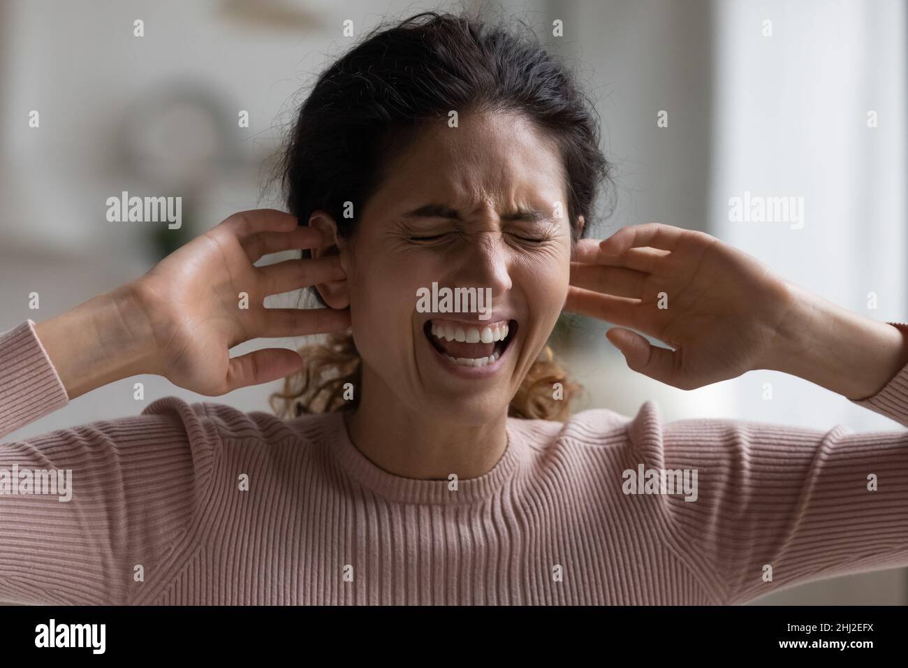Woman Plug Ears High Resolution Stock Photography and Images - Alamy
