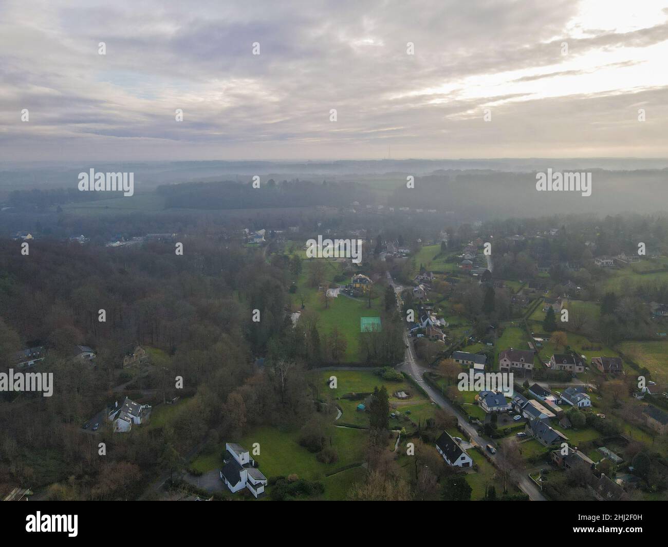 Aerial view of houses surrounded by forest in the country side area of ...
