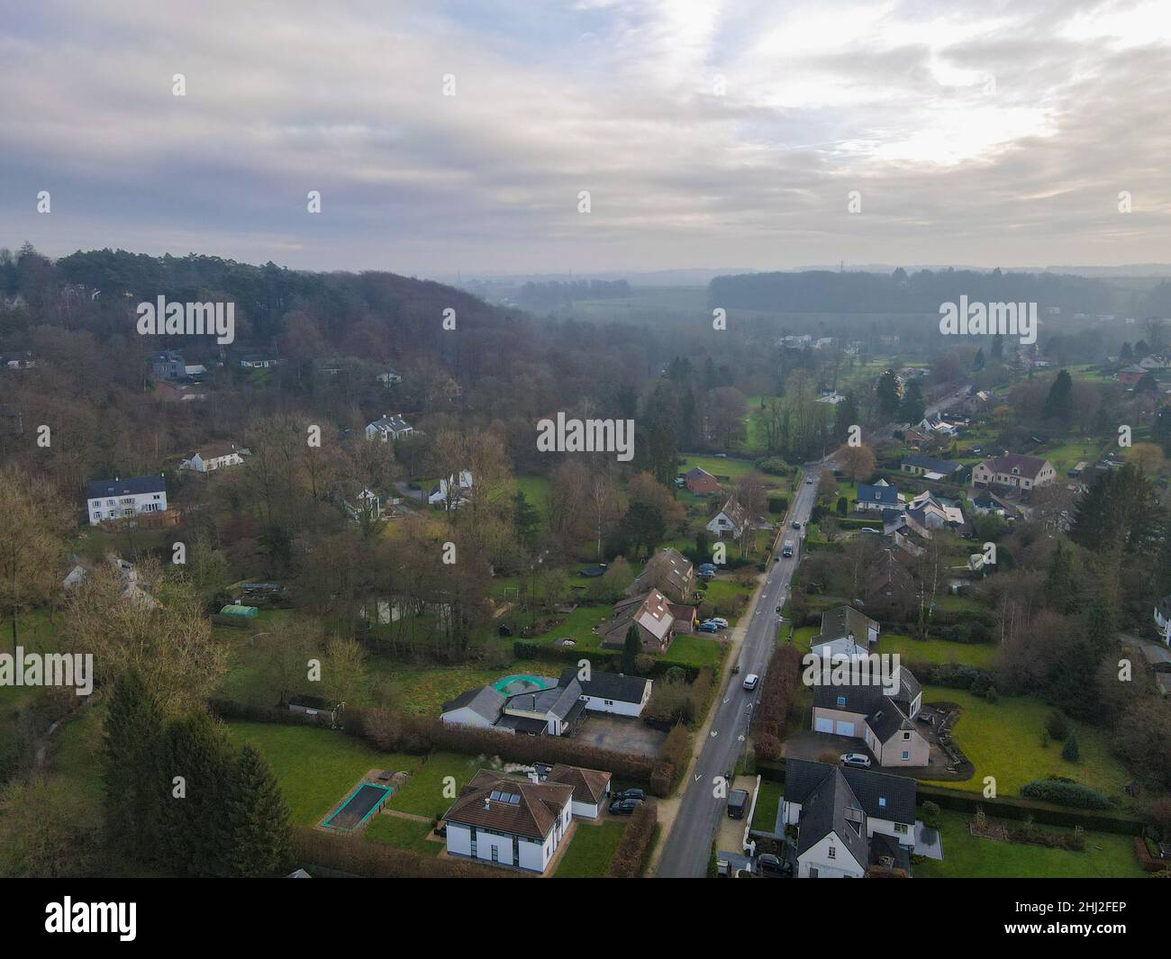 Aerial view of houses surrounded by forest in the country side area of ...